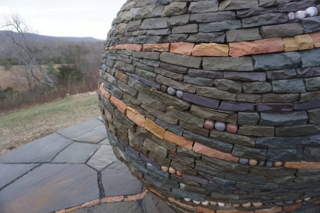 land art installation | dry stone wall patio and sphere sculpture